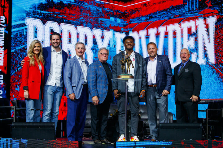 Malik Willis receives Bobby Bowden Trophy during ‘Faith & Football ...